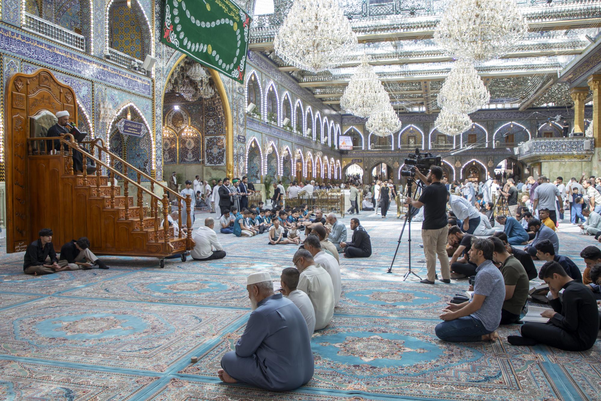 Visitors perform the rituals of reading the Dua al-Nudba in the ...