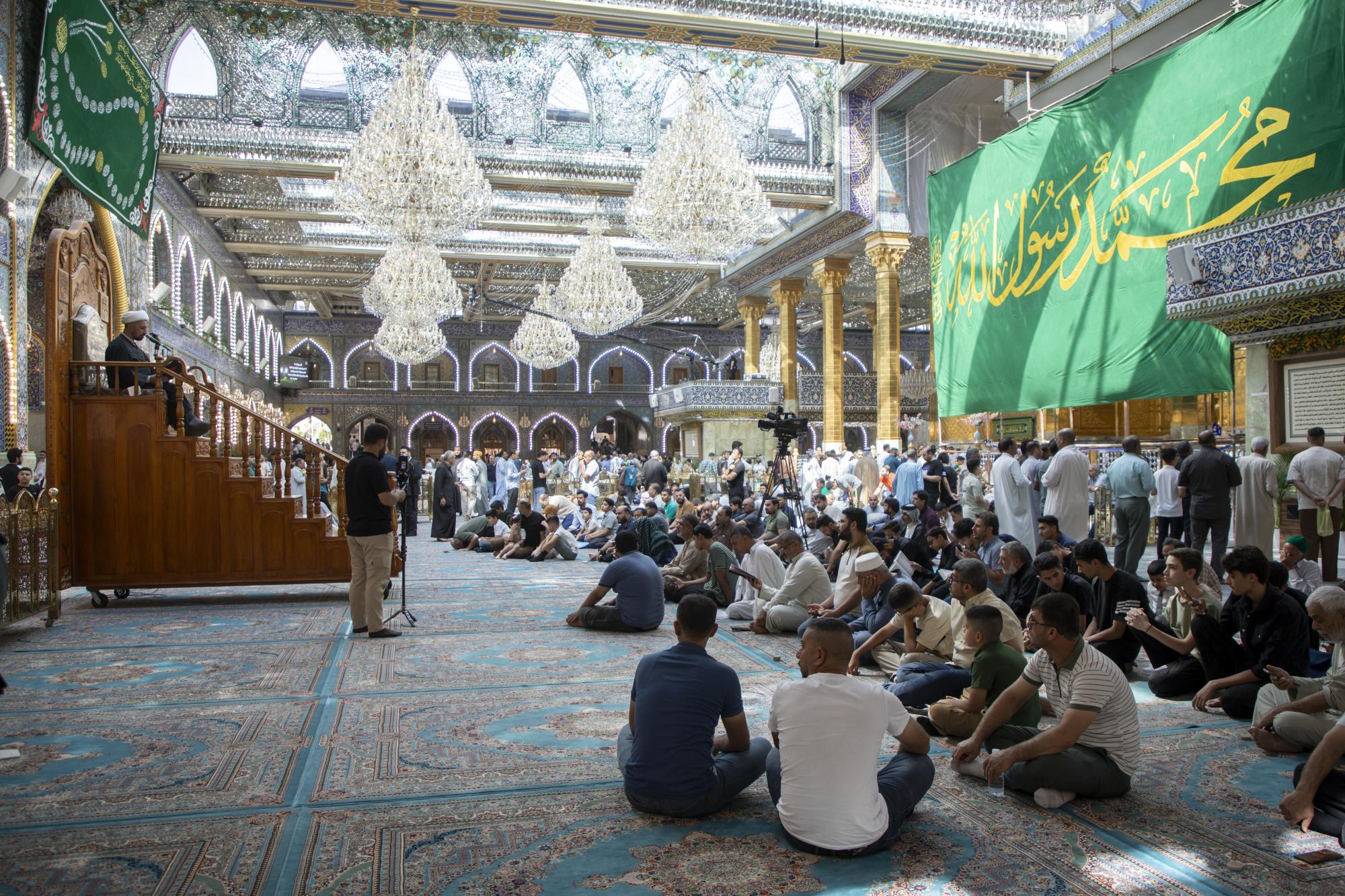 Visitors perform the rituals of reading the Dua al-Nudba in the ...